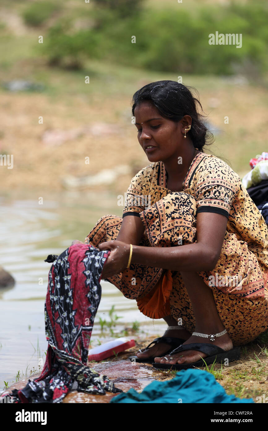 Rural Indian woman doing heir laundry Andhra Pradesh South India Stock ...