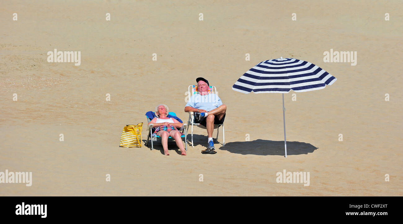 Old man sunbathing on beach hi-res stock photography and images - Alamy