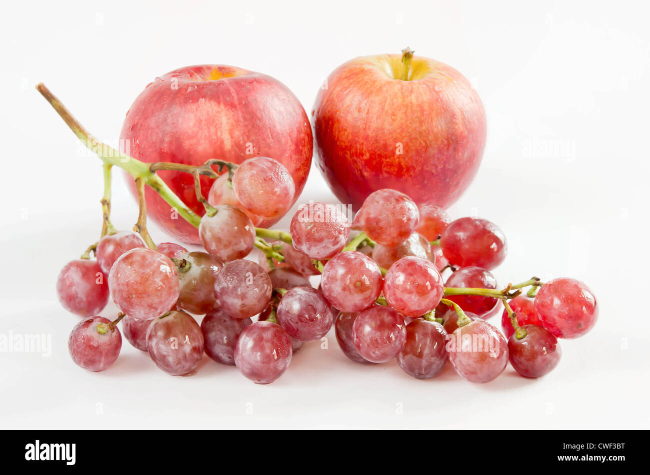 bunch of red grapes and red apple Stock Photo - Alamy