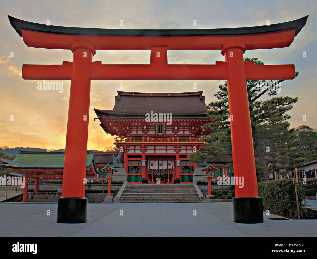 framed by entrance gate Red temple pavillion framed by large red torii ...
