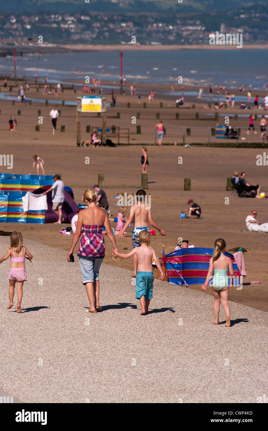 Family Day Out At The Beach (selective focus on the family walking ...