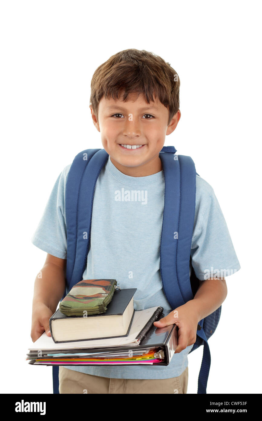A young boy with a backpack returns to school after the holidays ...