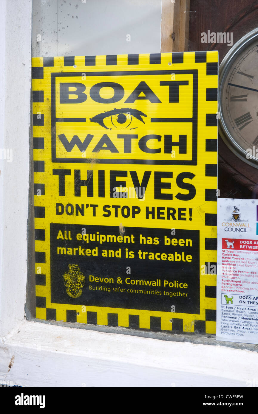 a boat watch warning sign in a window of the harbour at st ives ...