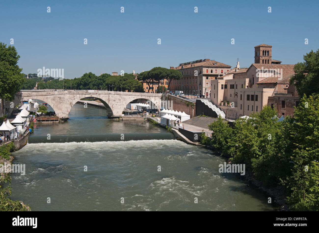 Tiber island, weir and Ponte Cestio Bridge viewed from the Ponte ...