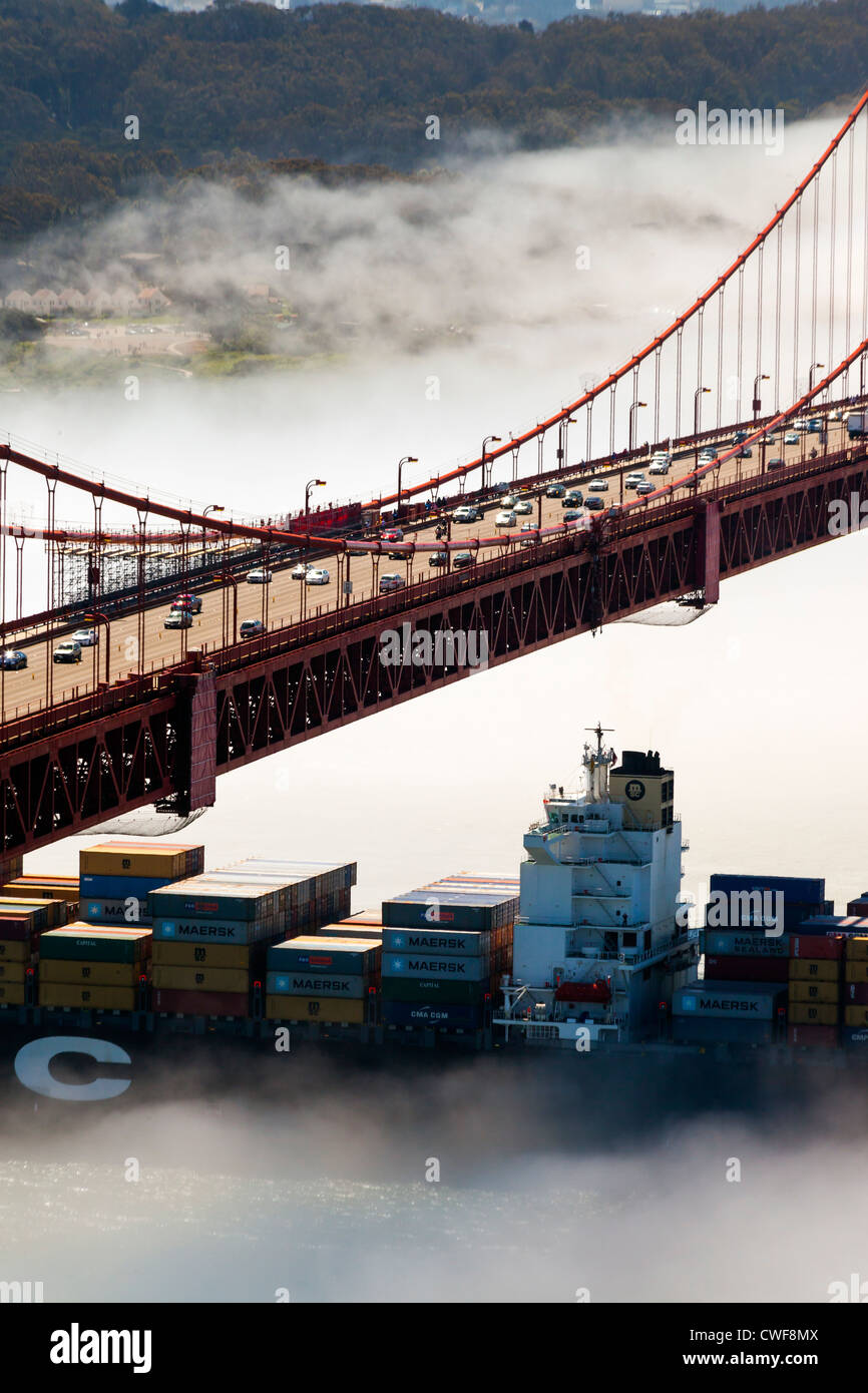 A cargo ship passing under the Golden Gate bridge, San Francisco Stock ...