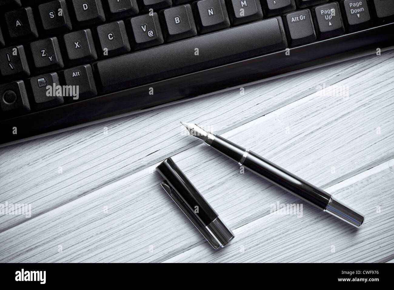the fountain pen and computer keyboard Stock Photo - Alamy