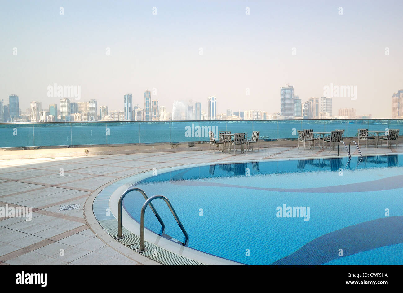 Swimming pool with Sharjah fountain and man-made lake view at the ...