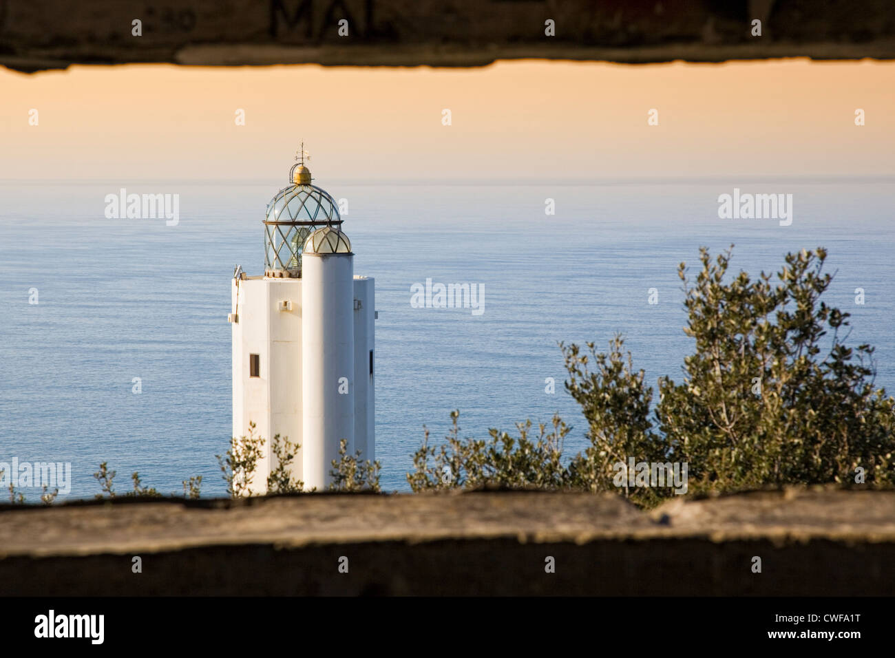View of a white lighthouse during daylight from inside a bunker Stock ...