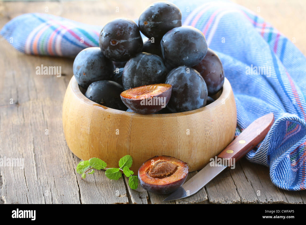 ripe, fresh red plums on the table Stock Photo - Alamy