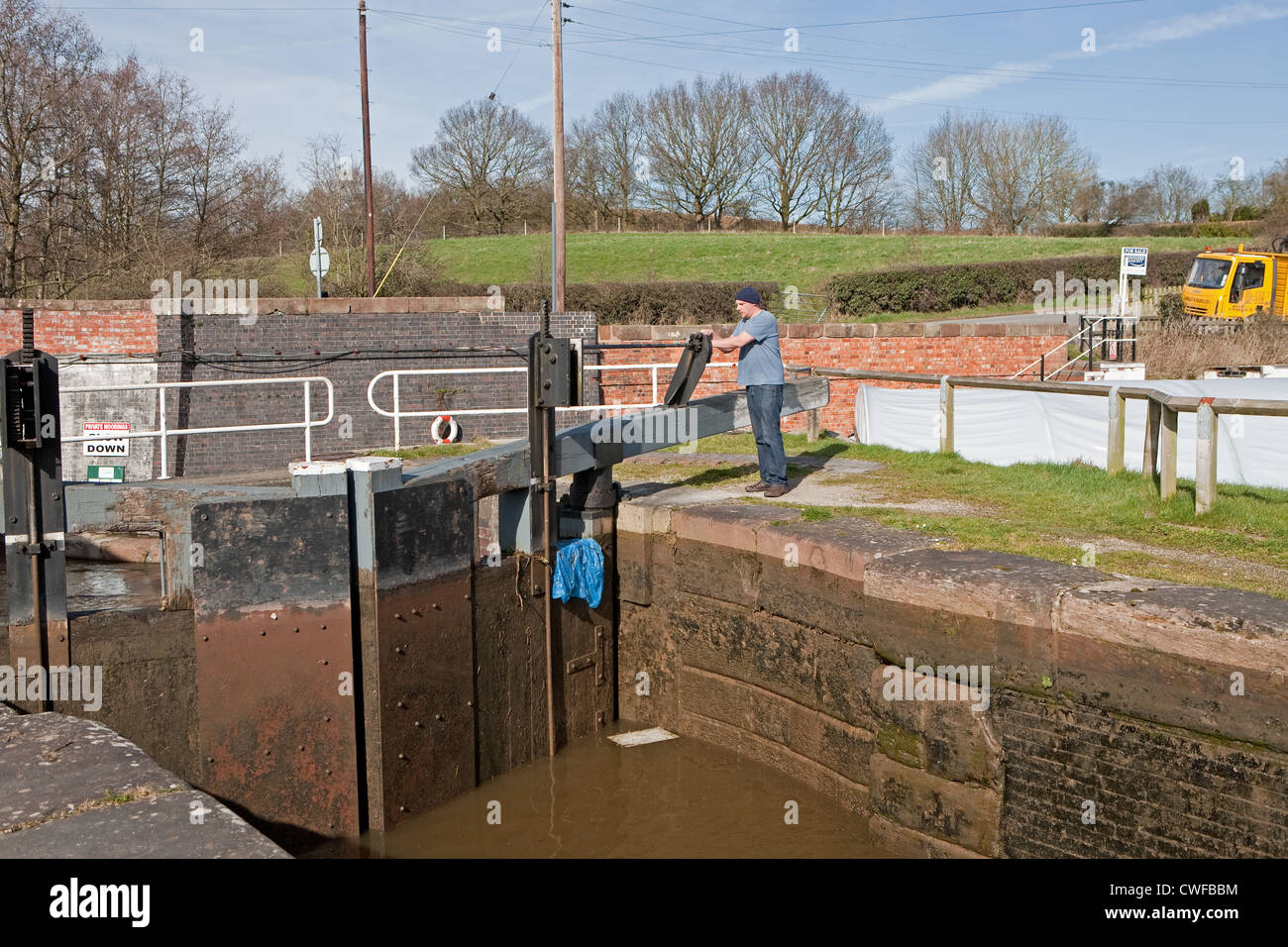 Bunbury staircase lock gates in cheshire being opened by a canal boat ...