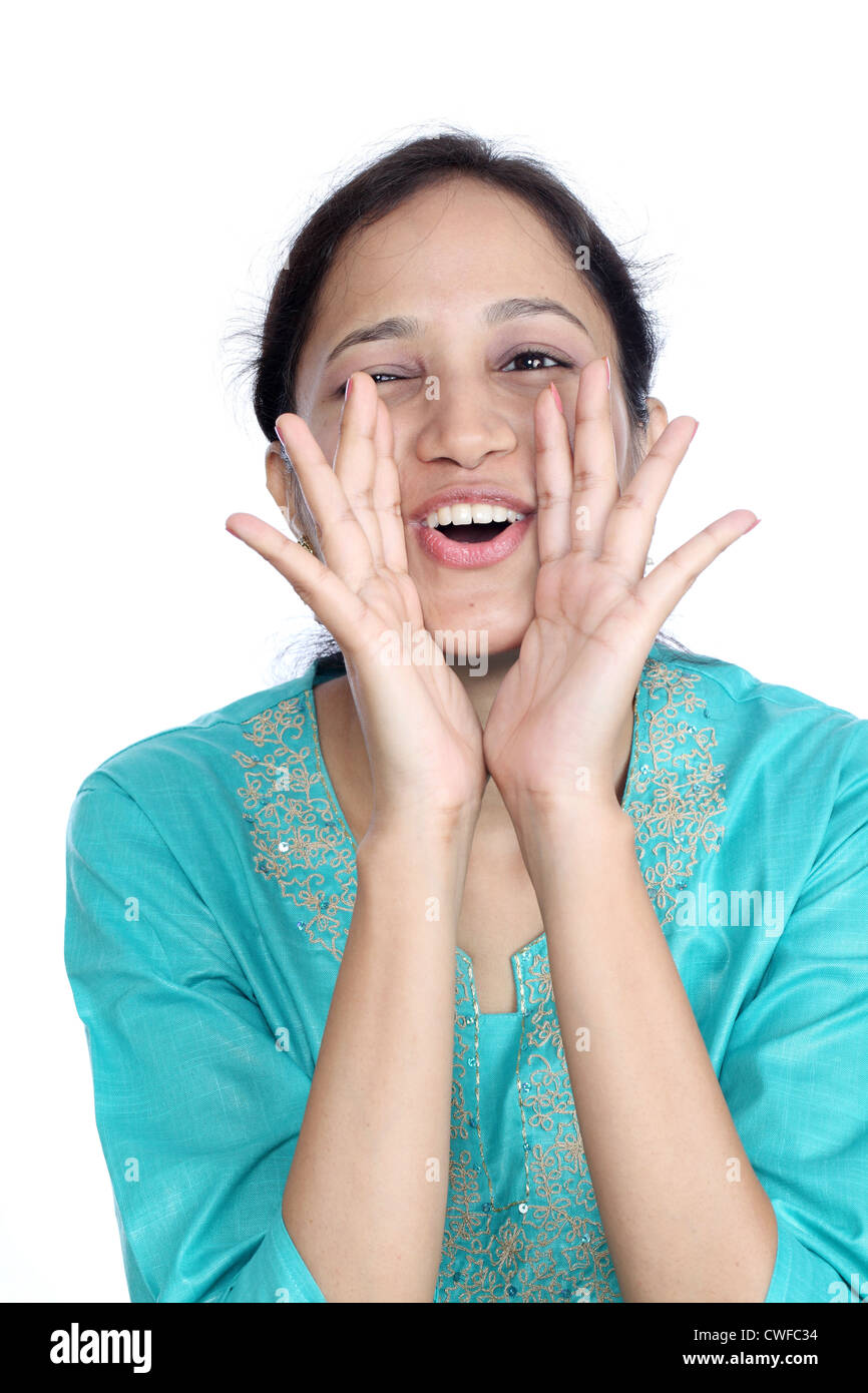Young woman screaming against white background Stock Photo - Alamy