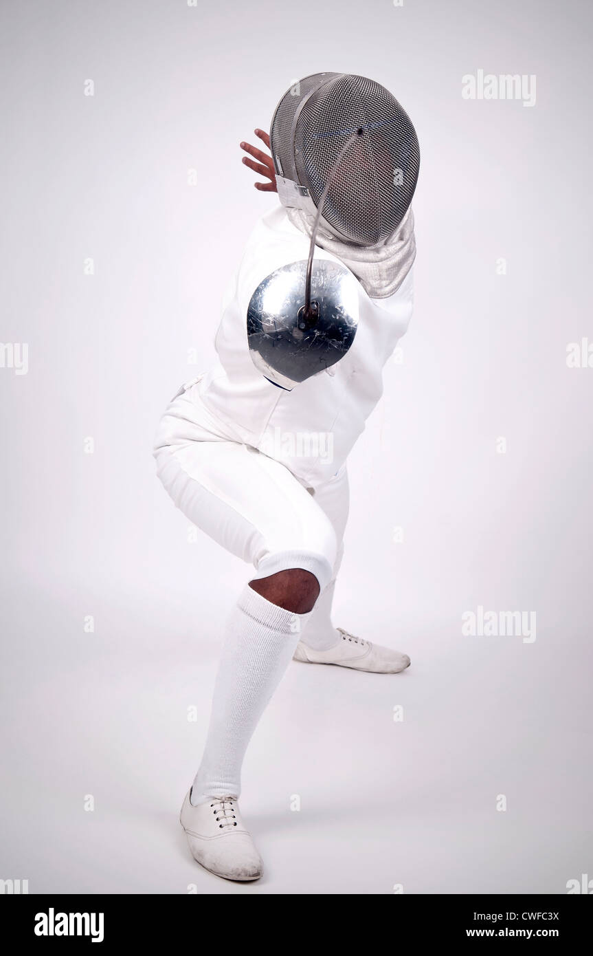 Male fencer isolated in a light background Stock Photo - Alamy