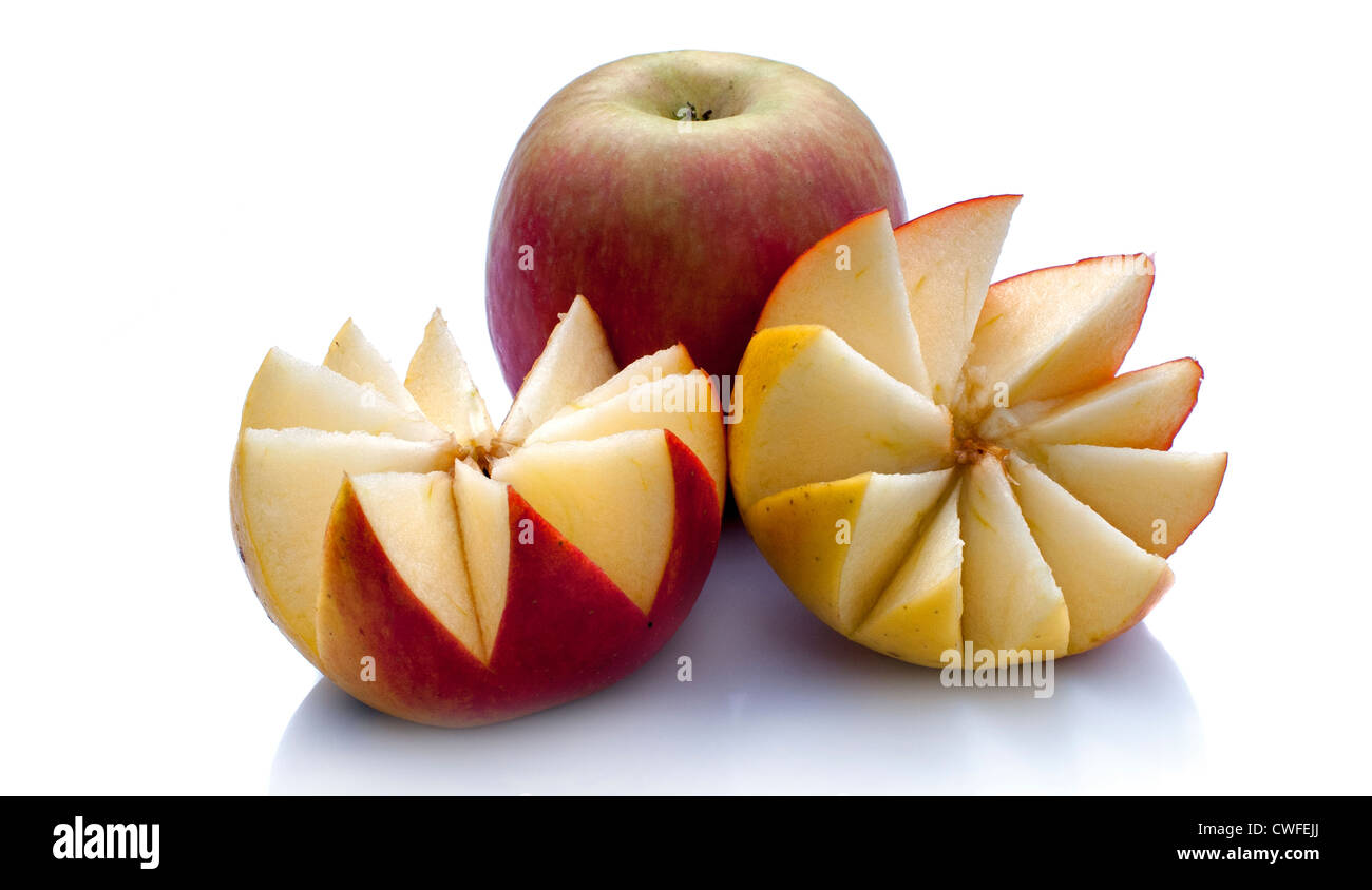 uncut apple and one in piece on white background Stock Photo - Alamy