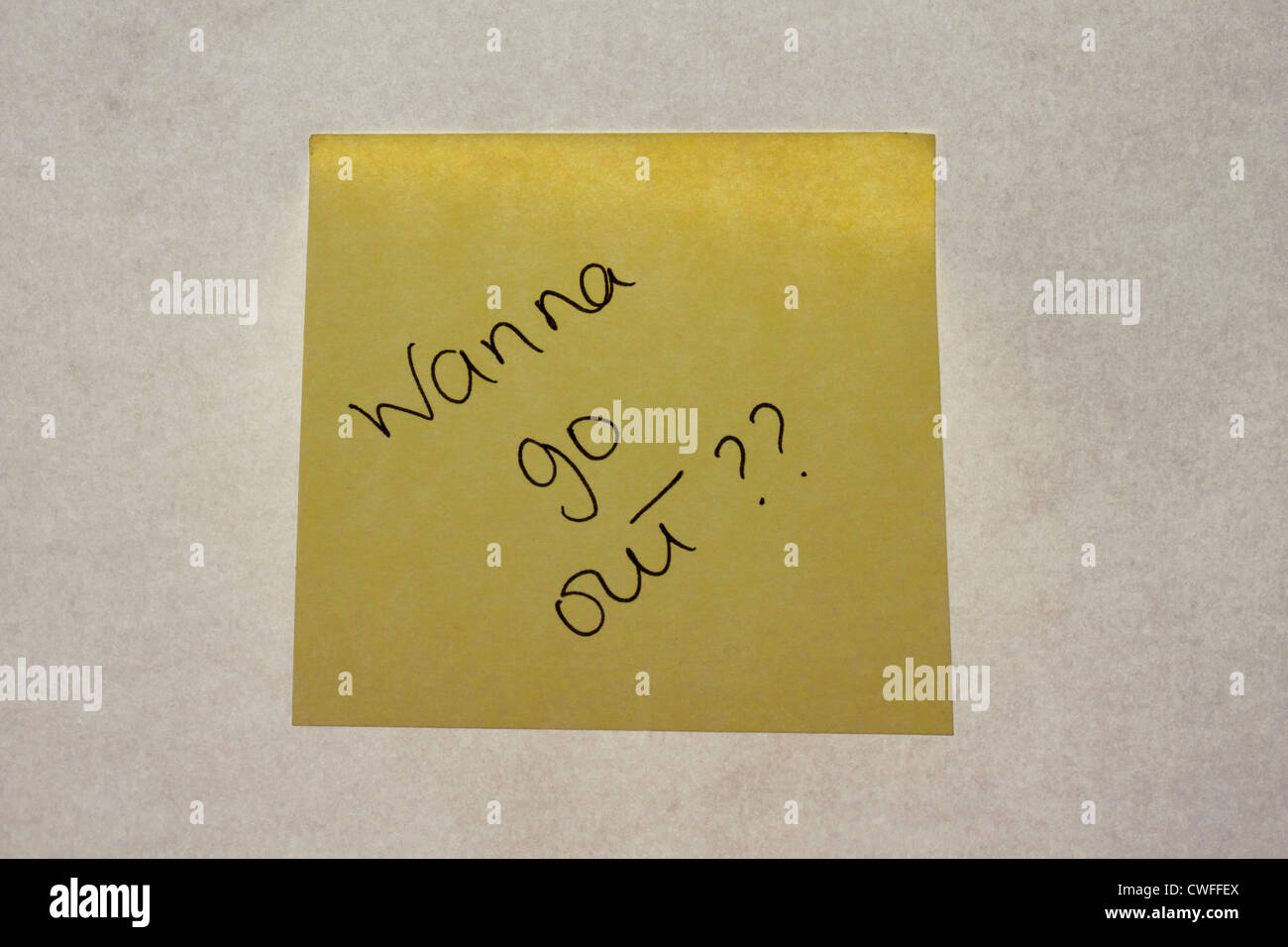Post it message in white background with the words Wanna go out Stock ...