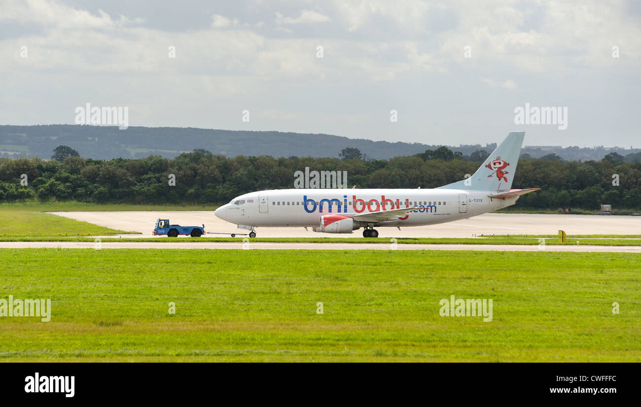 BMI baby plane being towed down a taxi way at east midlands airport ...