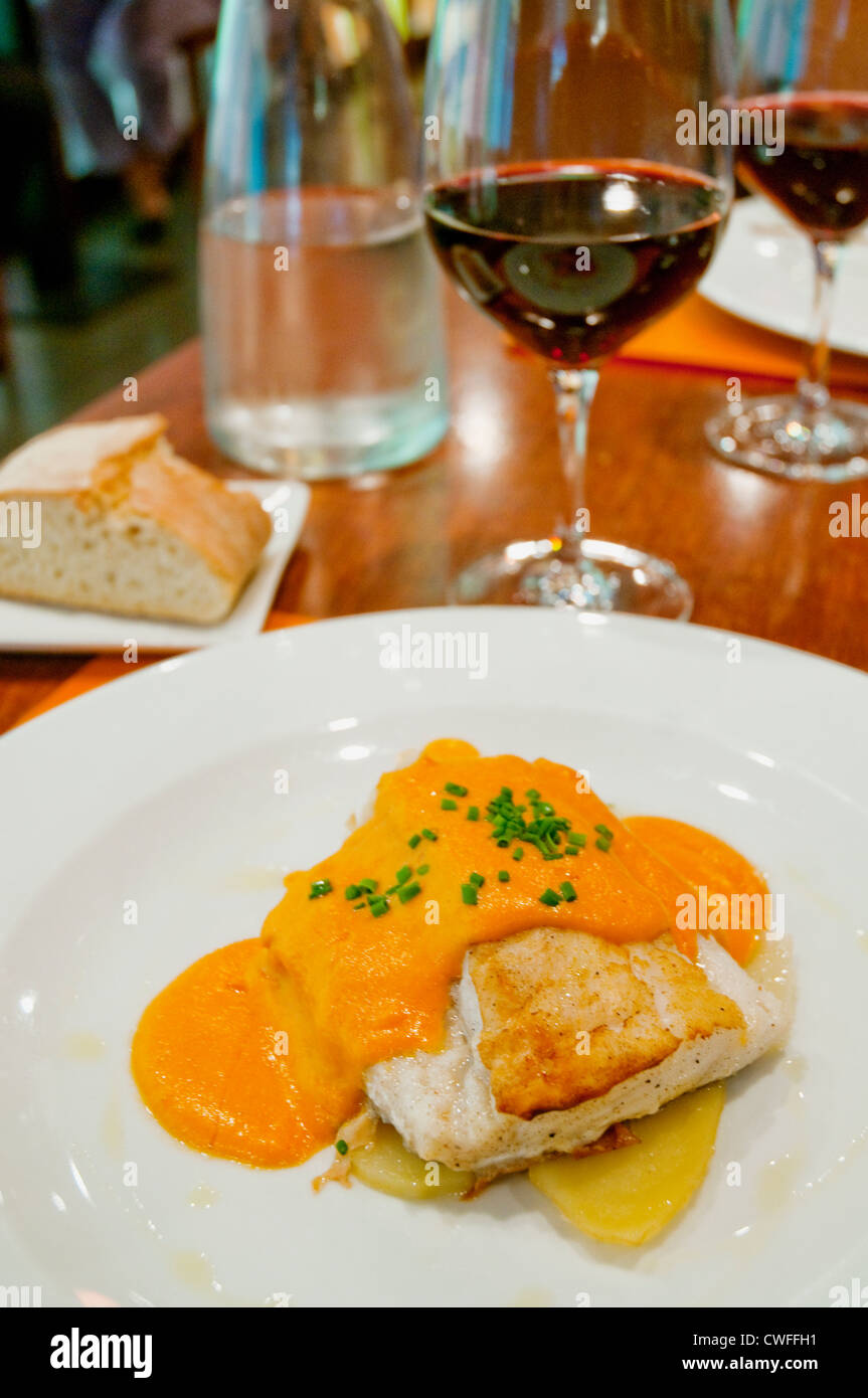 Cod with red pepper sauce Stock Photo - Alamy