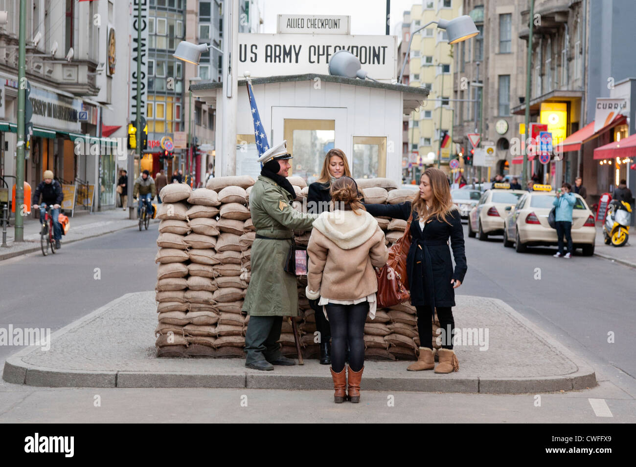 Tourists at checkpoint Charlie, former crossing point in Berlin Wall ...