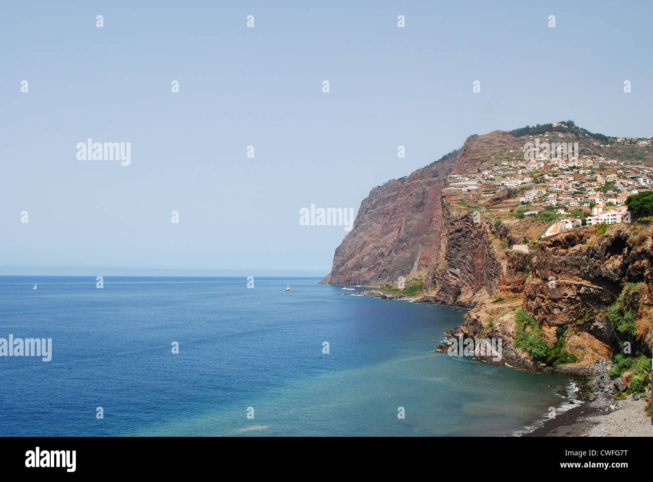 View of cliff village by the Atlantic Ocean shore Stock Photo - Alamy