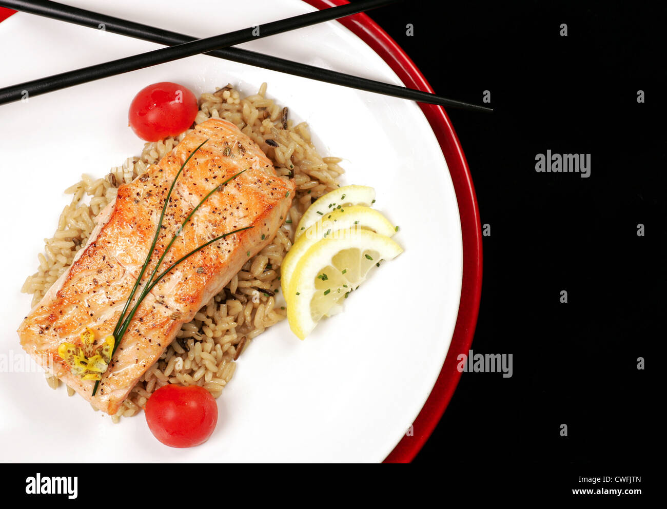 A plate of food with wild rice and salmon Stock Photo - Alamy