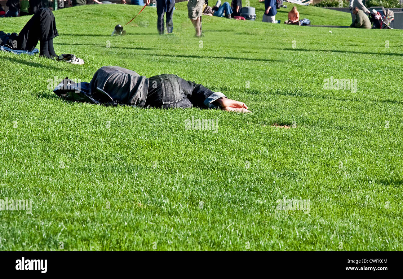 Homeless person sleeping in a park hi-res stock photography and images ...
