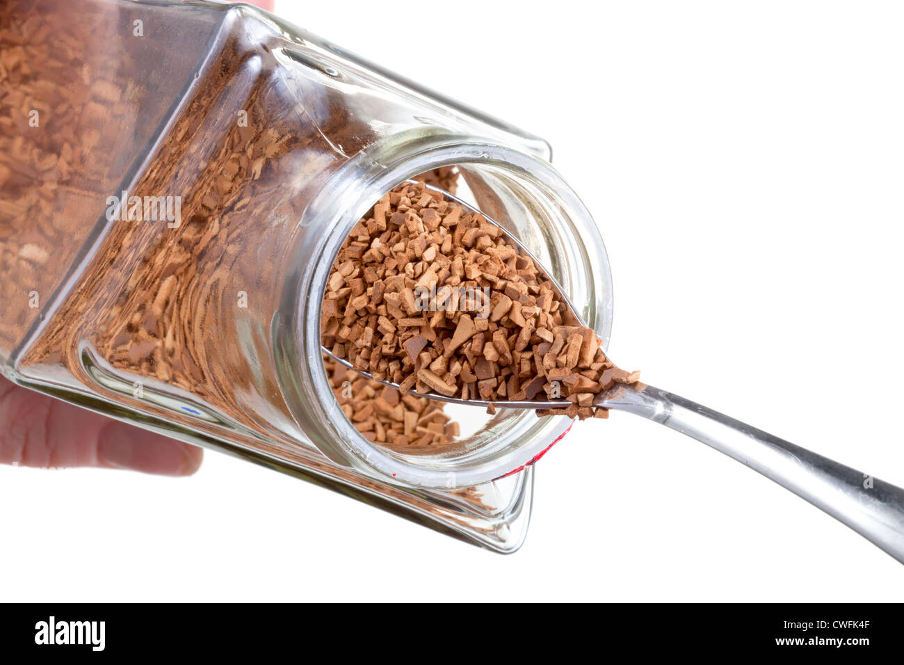 spoon in glass pot with instant coffee isolated on white background ...