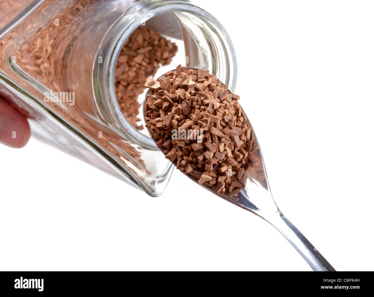spoon in glass pot with instant coffee isolated on white background ...