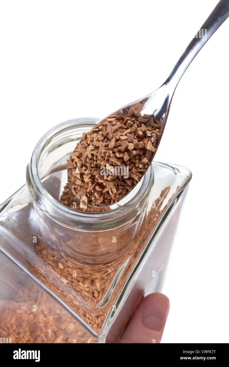 spoon in glass pot with instant coffee isolated on white background ...