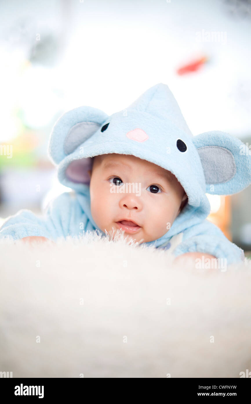 cute baby lie on bed with white background Stock Photo - Alamy