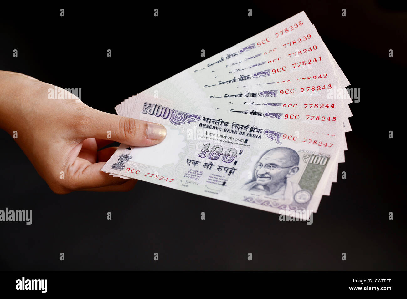Hand holding indian rupee notes hi-res stock photography and images - Alamy