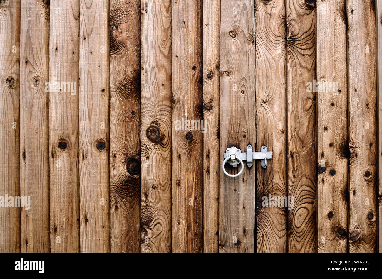 Wooden gate panels with metal gate latch Stock Photo - Alamy