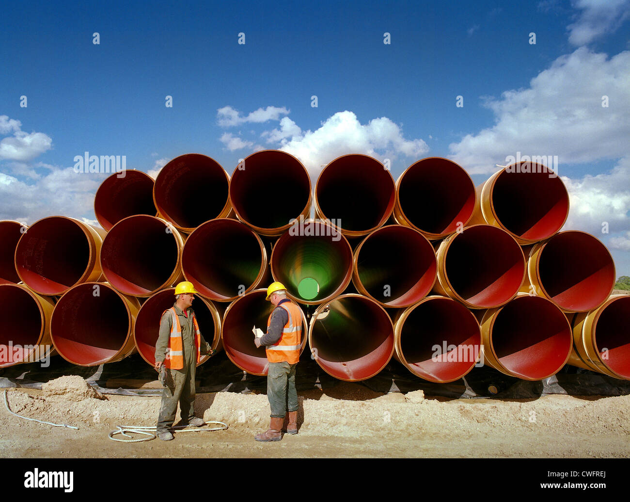 Steel gas pipes stacked up ready to be laid at a site in Lincolnshire ...