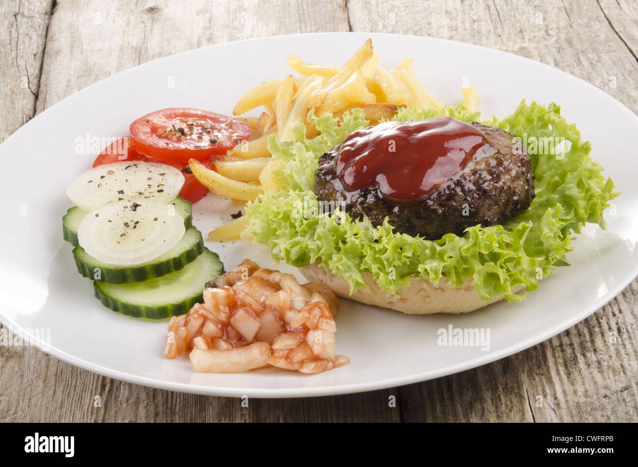 home made hamburger with tomato and sliced cucumber Stock Photo - Alamy