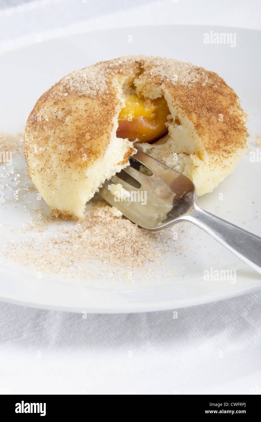 fruit dumpling with cinnamon and sugar on a plate Stock Photo - Alamy