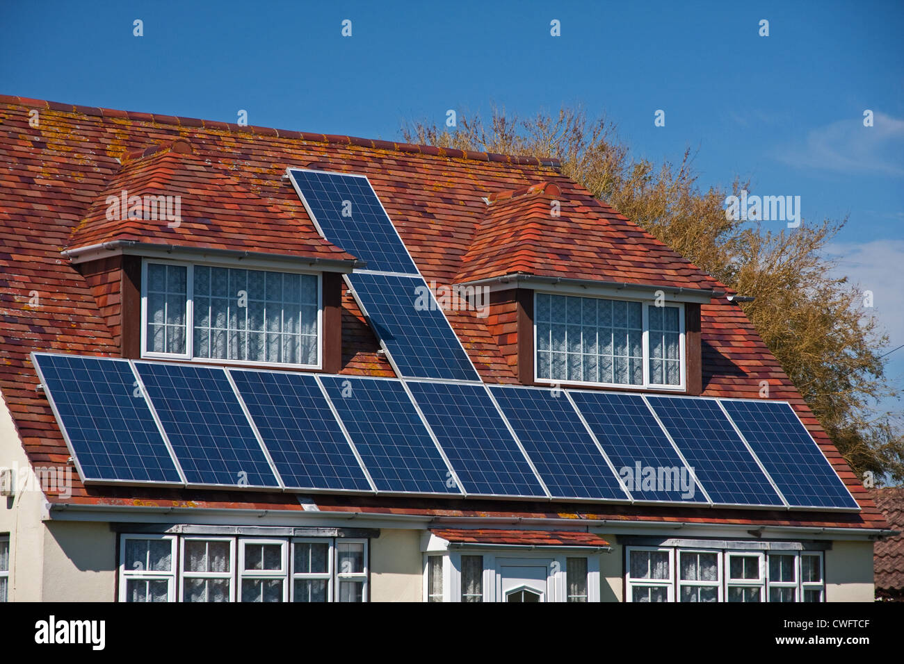 Solar panels on roof of detached house Stock Photo - Alamy