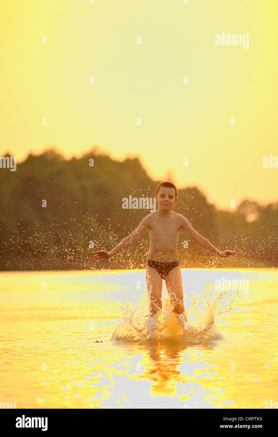 Boy jumping into river hi-res stock photography and images - Alamy