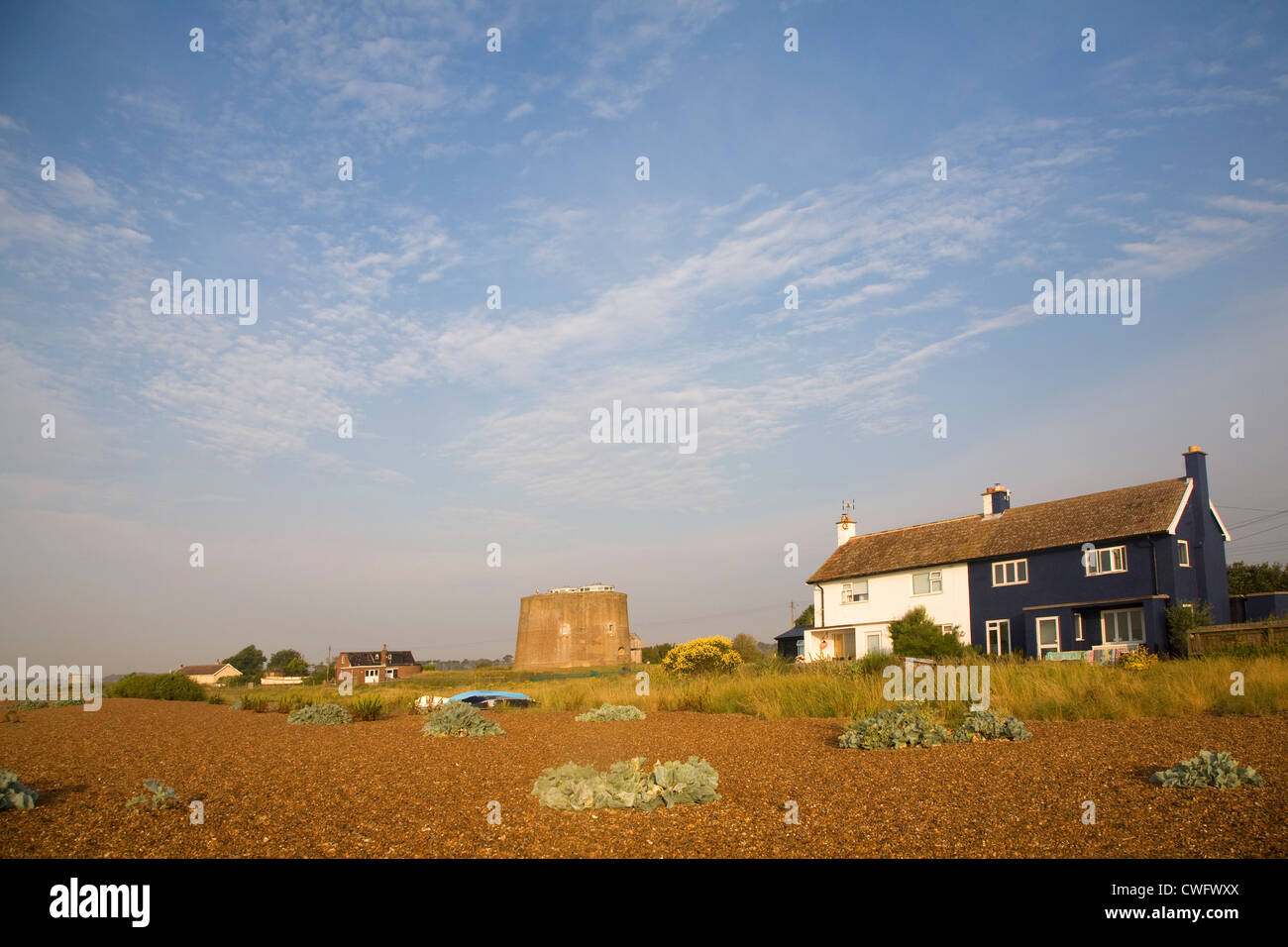 Martello tower beach homes Shingle Street Suffolk England Stock Photo ...