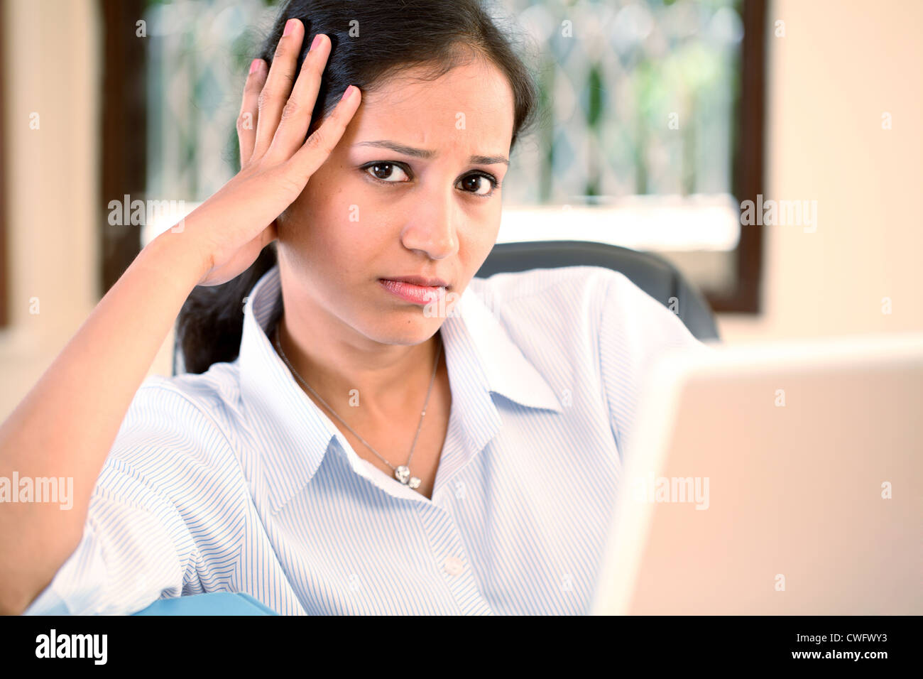 Stressed businesswoman at work Stock Photo - Alamy