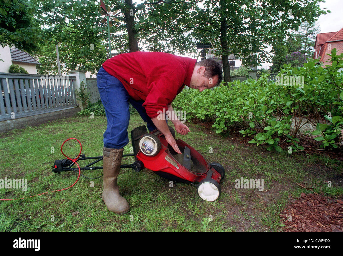 Stooping man hi-res stock photography and images - Alamy