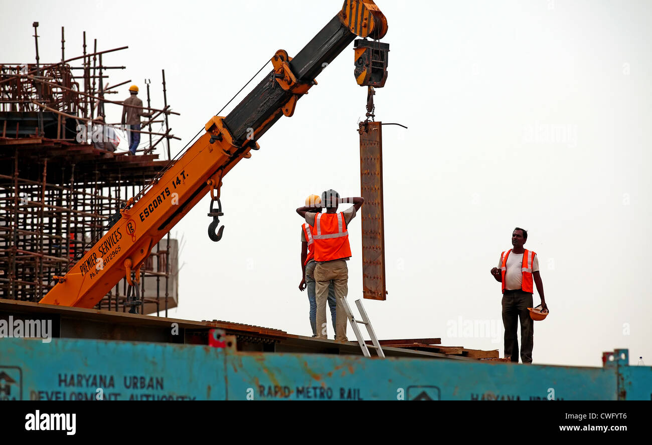 Workers at a construction site Stock Photo - Alamy