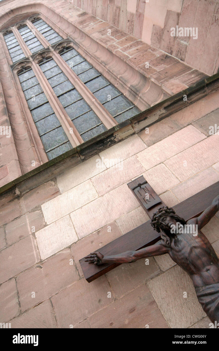 Wooden Jesus cross on the facade of a church Stock Photo - Alamy