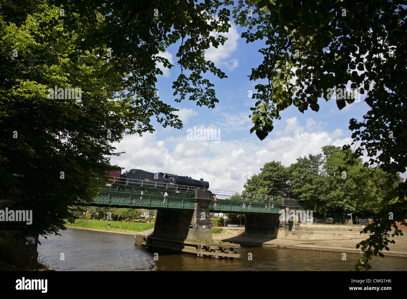 Preserved LMS Stanier class 8F 48151 steam loco crossing the River Ouse ...