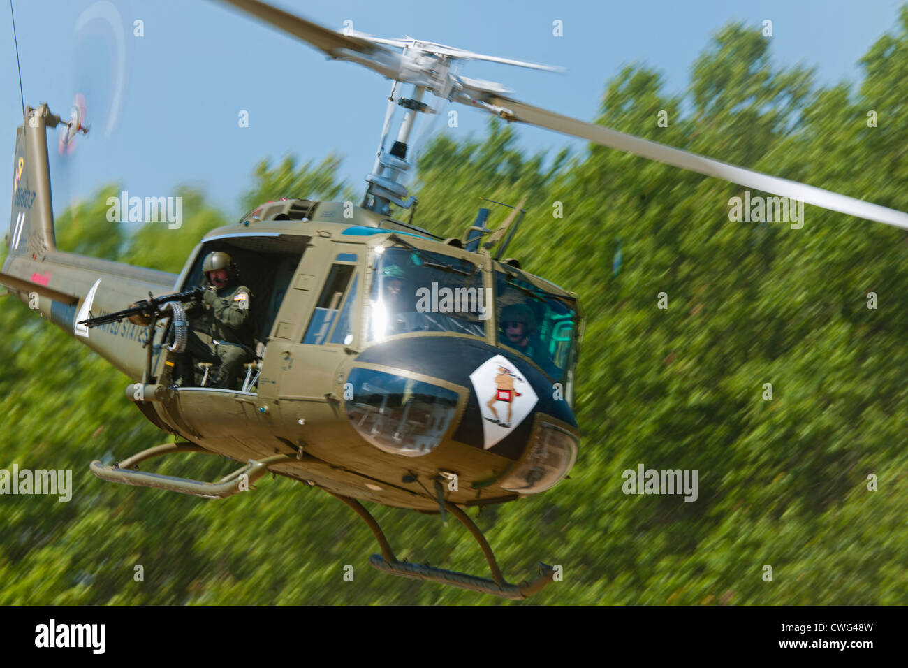 A restored Vietnam-era US Huey helicopter, equipped with an M60 MG ... A restored Vietnam-era US Huey helicopter, equipped with an M60 MG ...