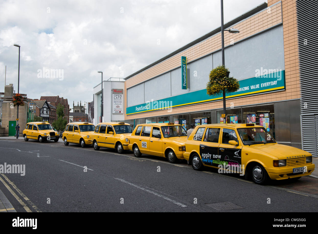 Yellow cabs queuing at taxi rank outside Poundland at The Spot on ...