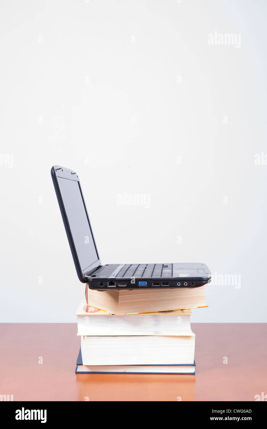 Laptop and books hi-res stock photography and images - Alamy