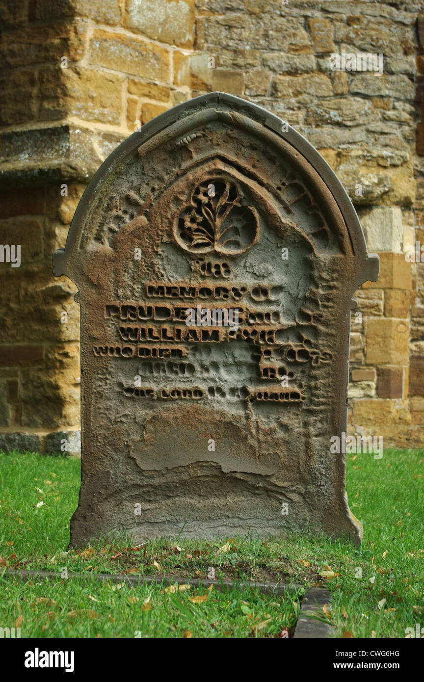 Heavily eroded gravestone in the churchyard of St Columba, Collingtree ...