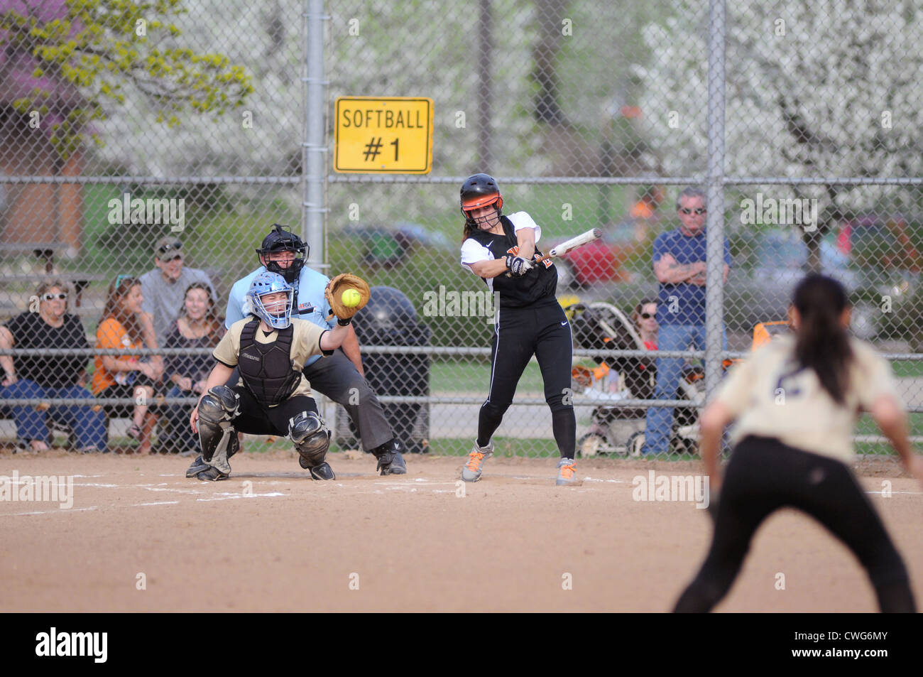 Softball hitter swings and misses a pitch.. USA Stock Photo - Alamy