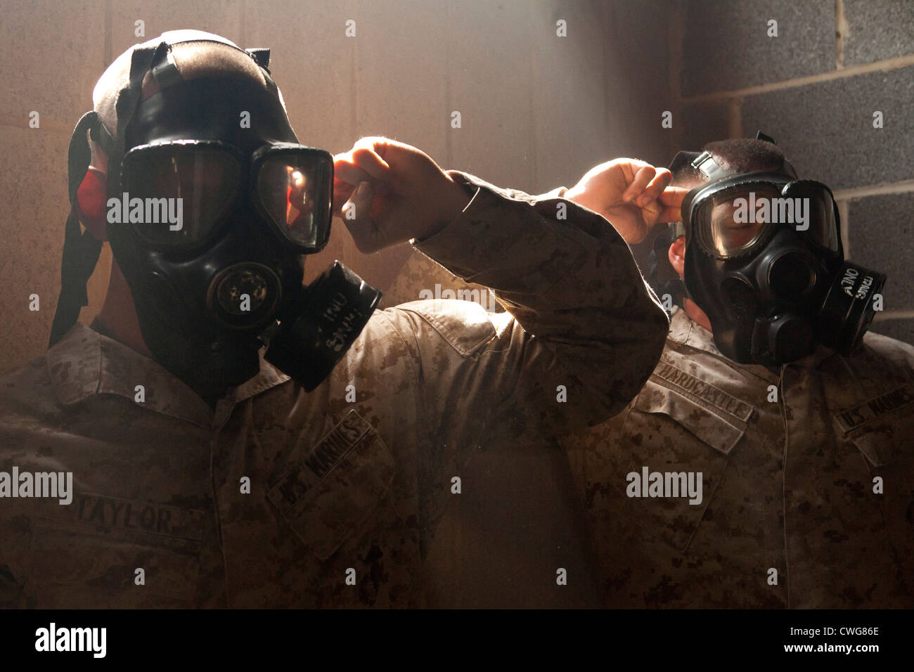 Marines break their masks seals inside of a gas contaminated chamber ...