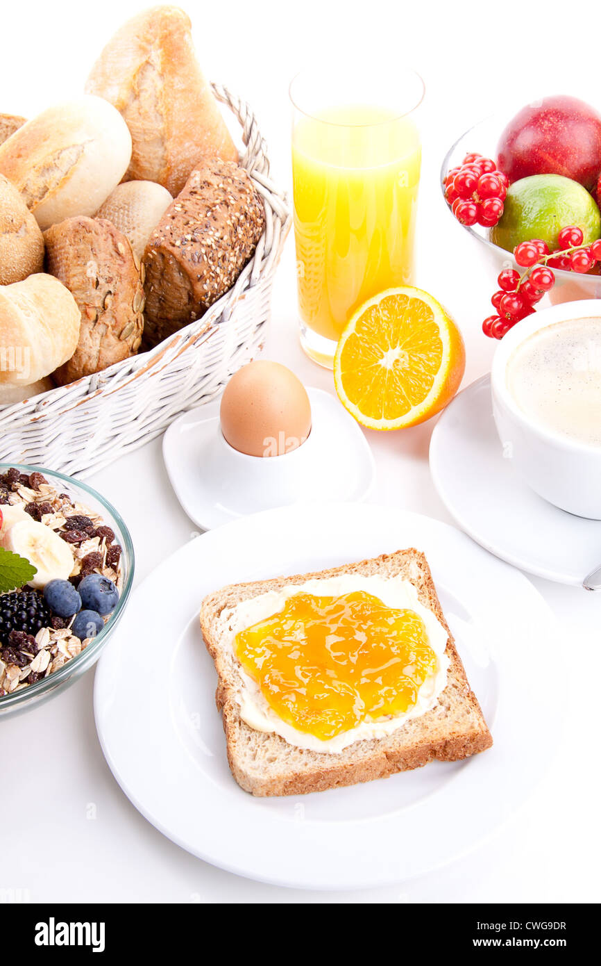 breakfast table with toast and orange marmelade isolated on white ...