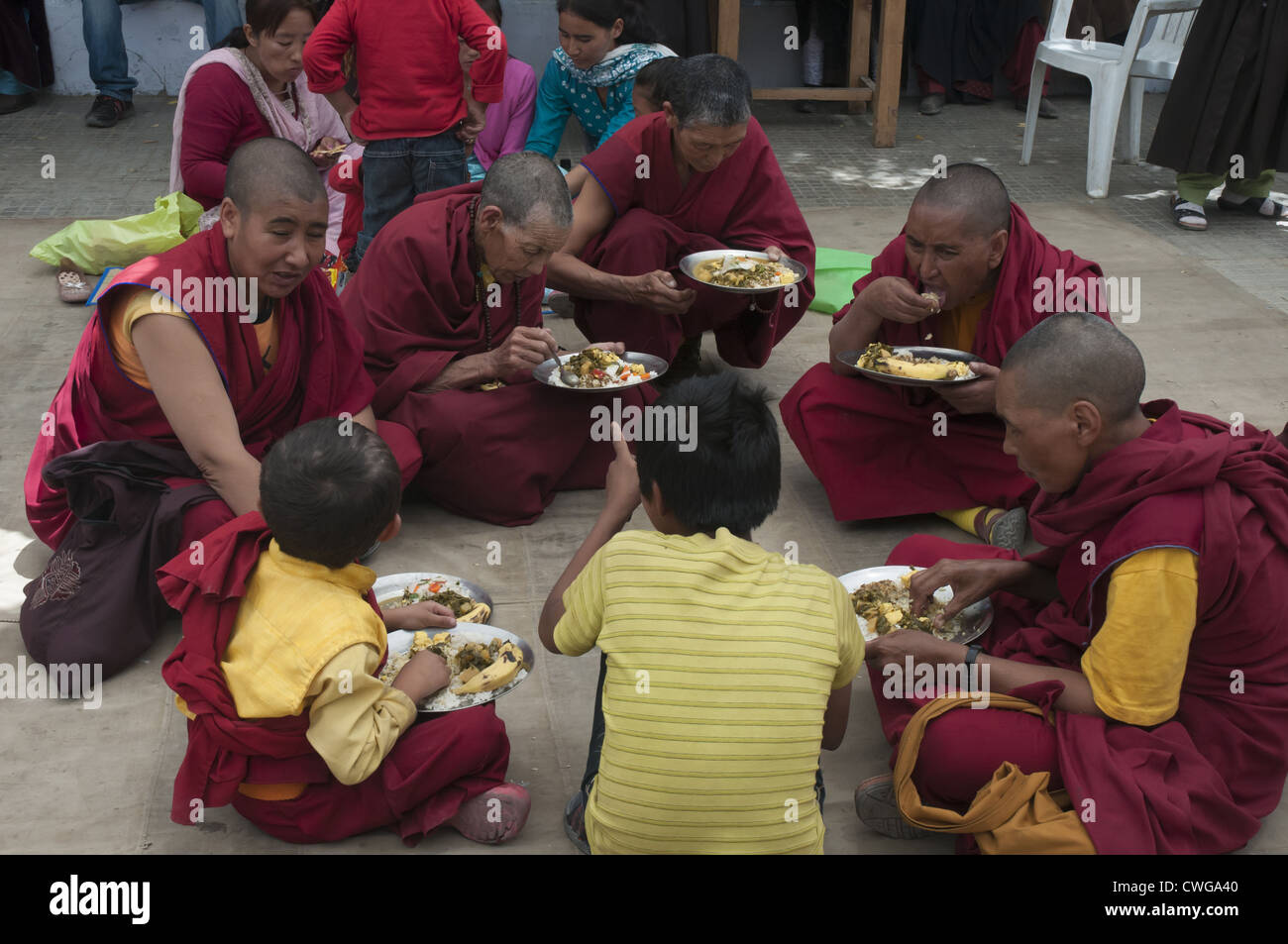 Buddhist monks and novices take lunch at the Chokhang Vihara, a temple ...