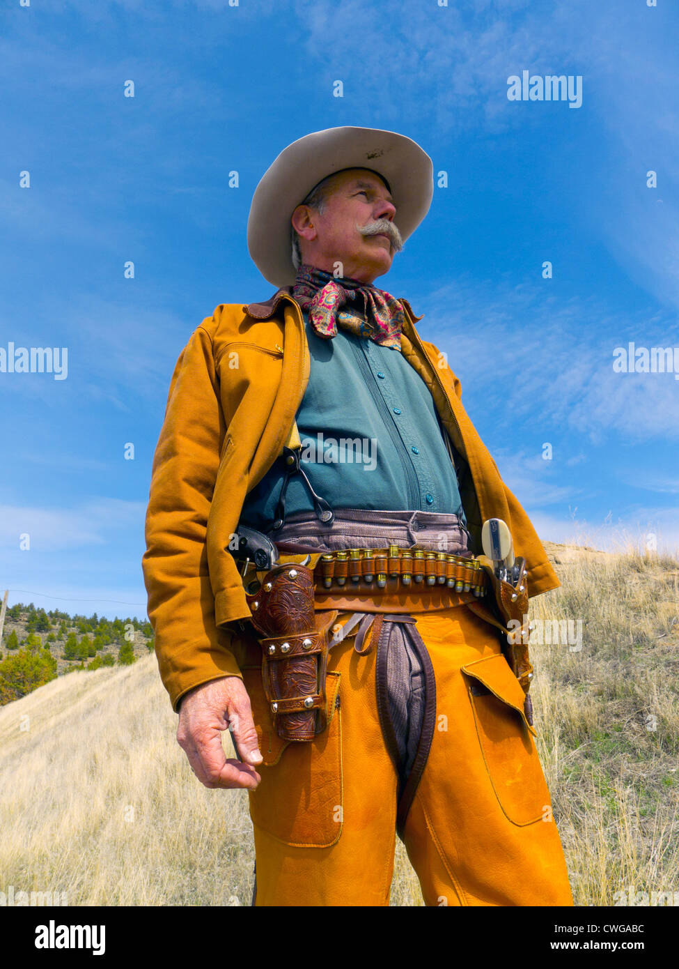Fast draw gun competitors posing for portraits at a shooting ...